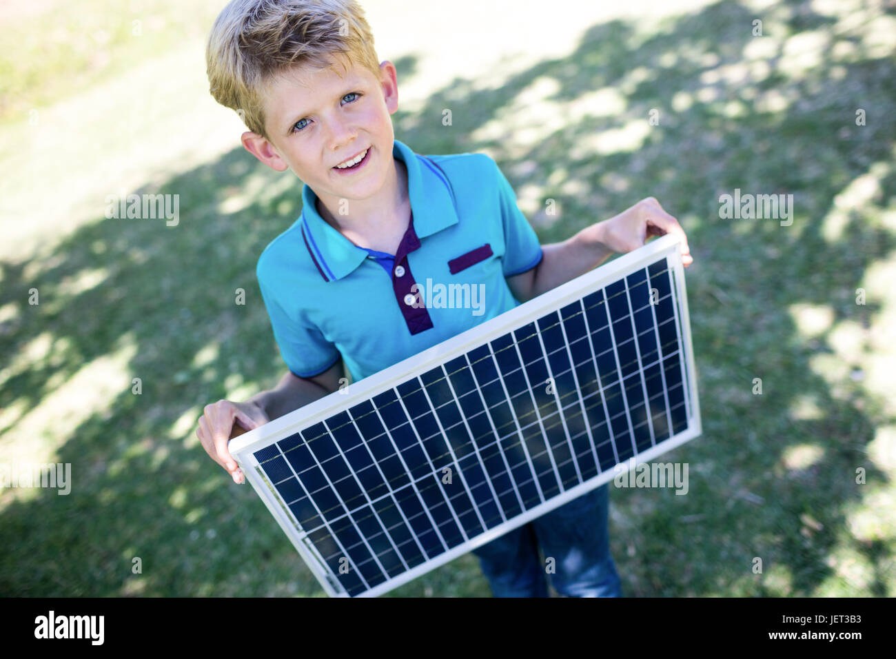 Boy holding a solar panel Stock Photo - Alamy