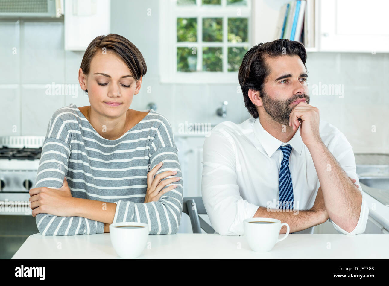 Couple and kitchen table and upset hi-res stock photography and images ...