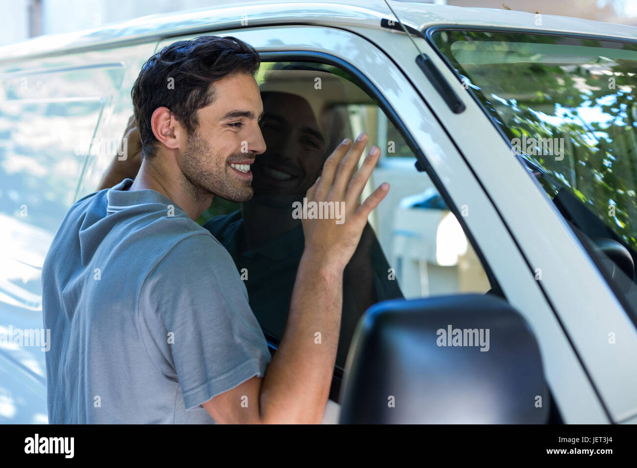 Man hugging his car hi-res stock photography and images - Alamy