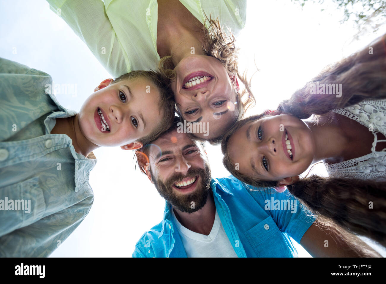 Family huddle hi-res stock photography and images - Alamy