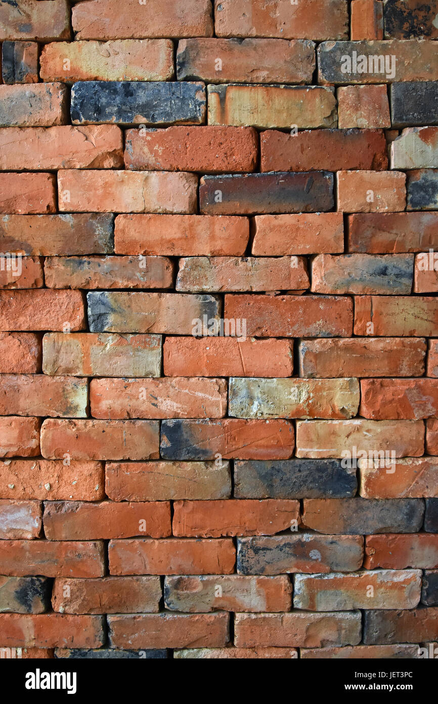 Rough red brown brick wall background texture without cement close up ...