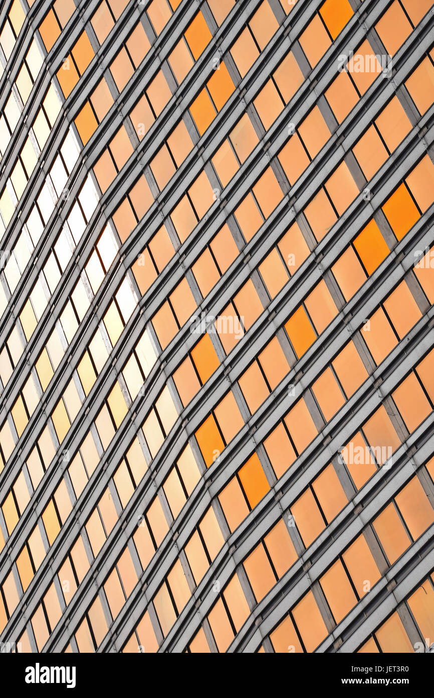 Orange colored glass windows of modern business office building at ...