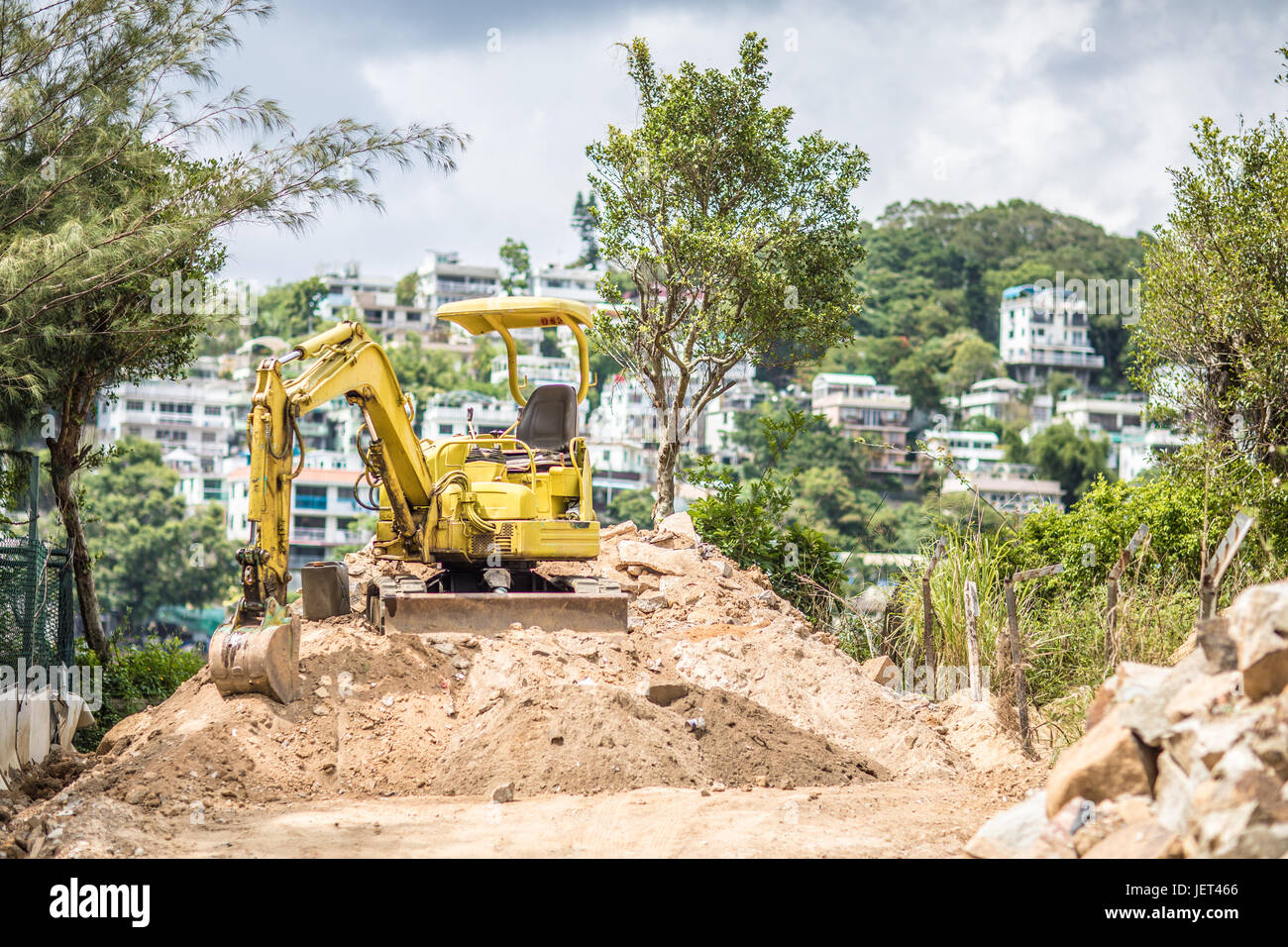 Excavator on construction site, outdoor Stock Photo - Alamy