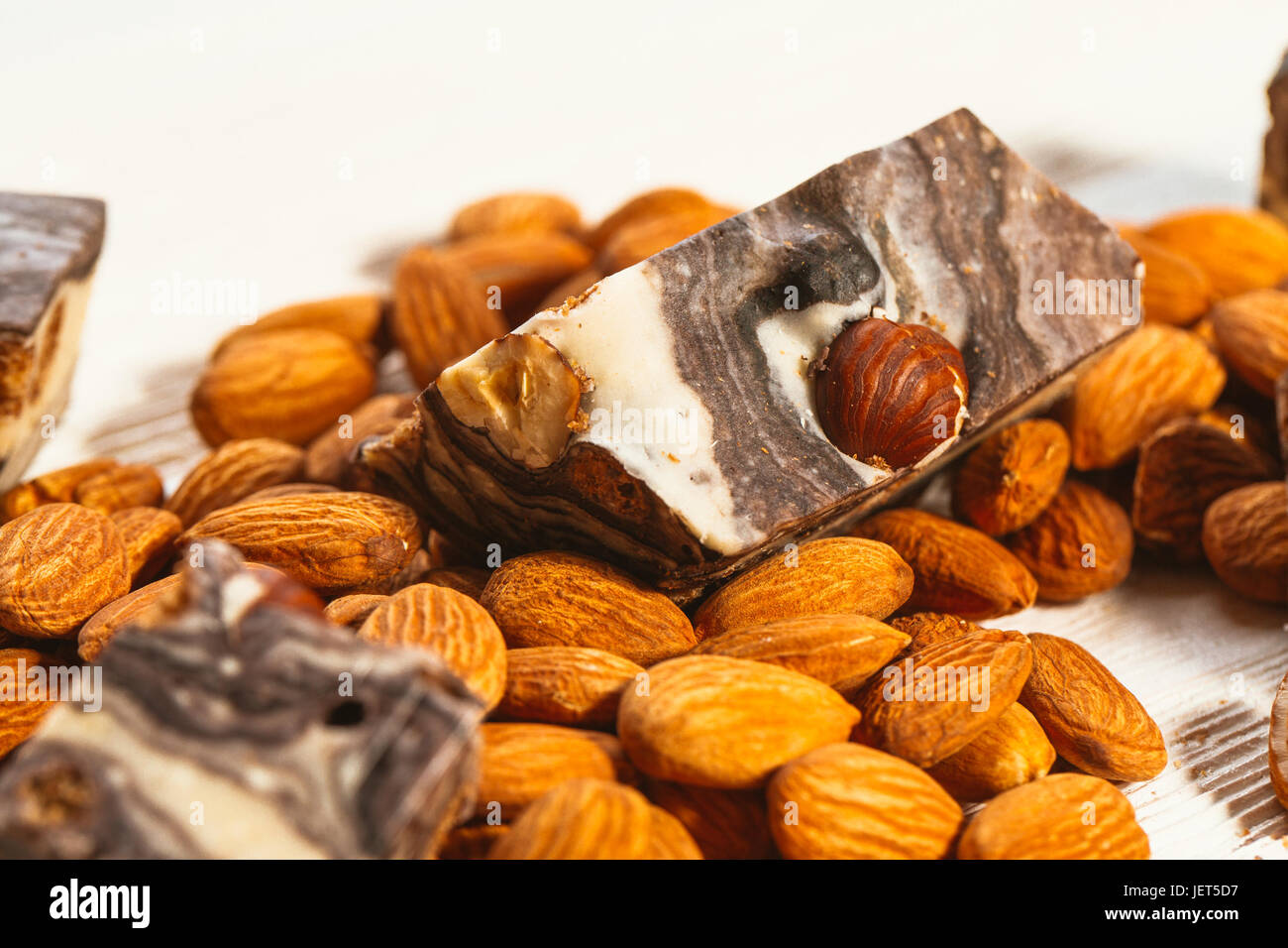 candy paste and almonds on white wooden background Stock Photo - Alamy