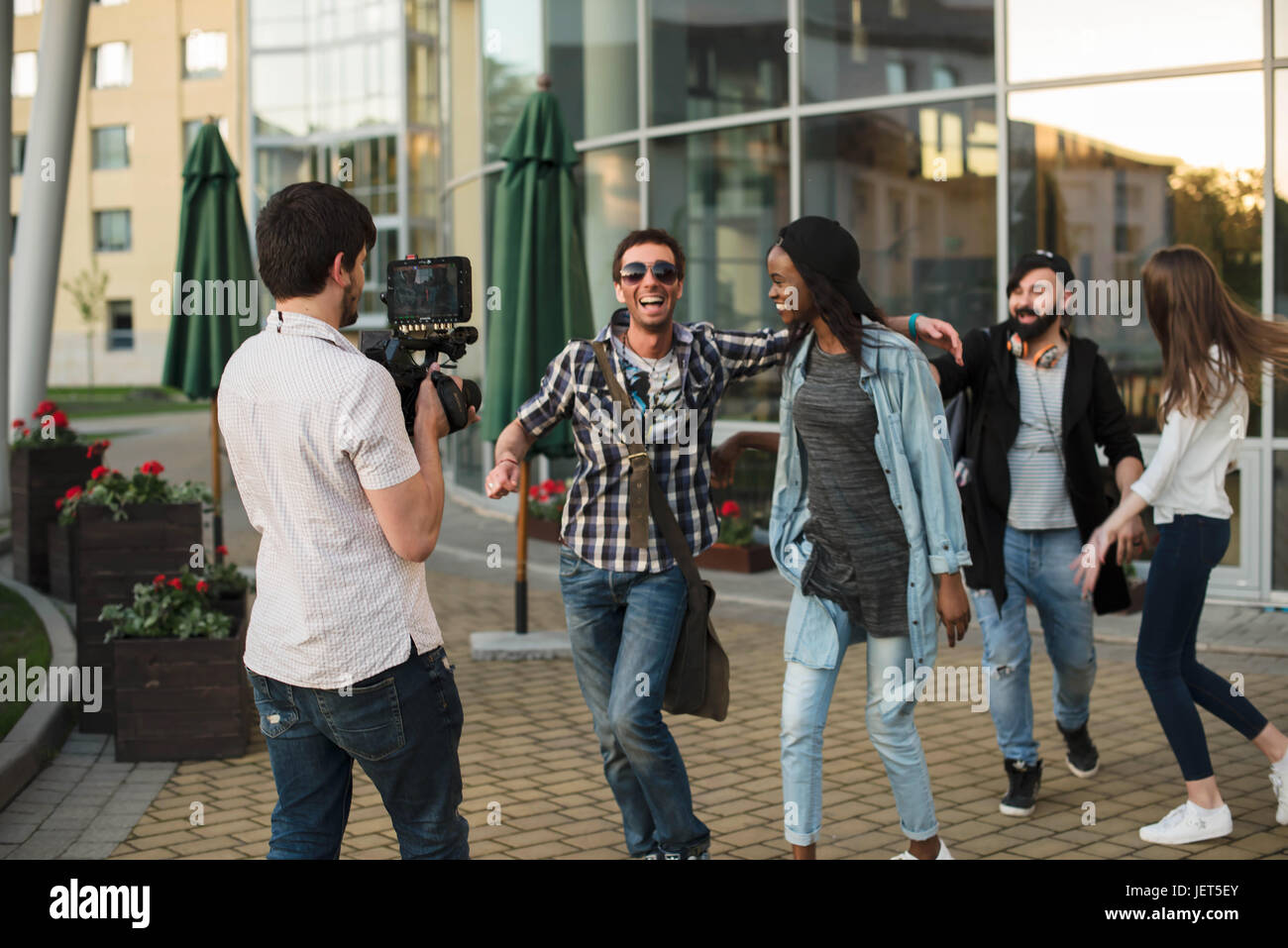Two couples posing for camera. Young people walking and smiling Stock ...