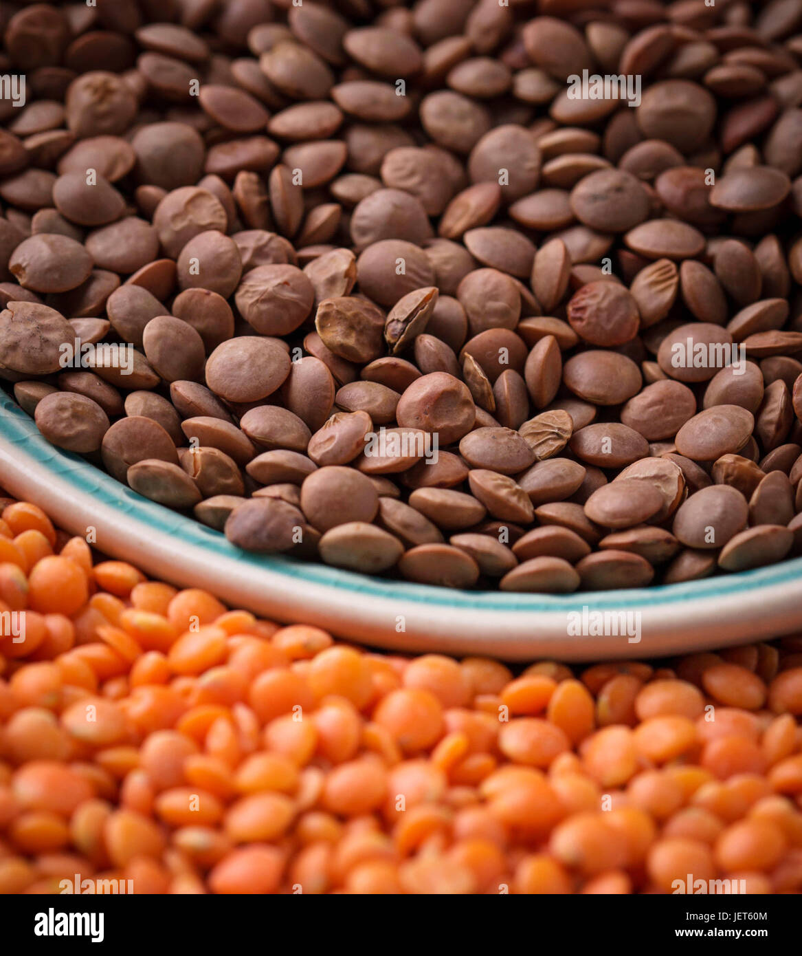 Bowls with red and black lentils. Selective focus Stock Photo - Alamy