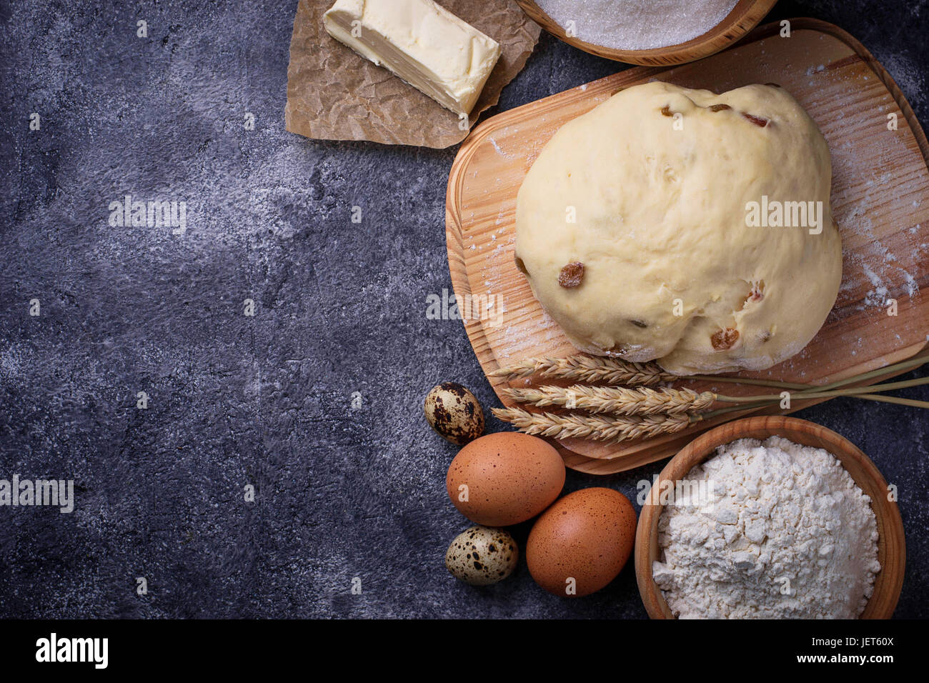 Dough and ingredients for baking. Egg, flour, sugar and butter ...