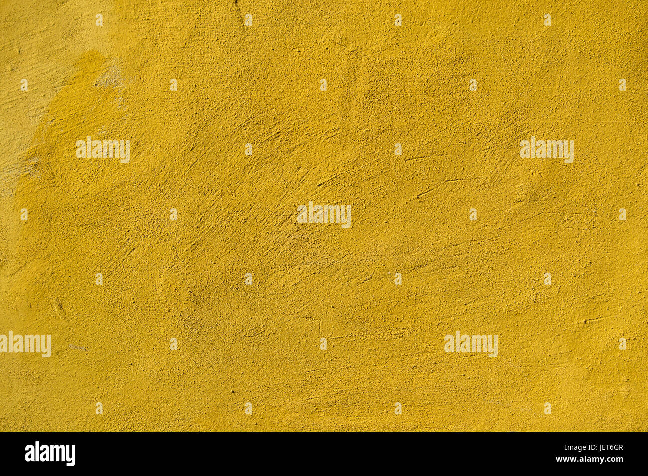 yellow concrete background texture with scraps Stock Photo - Alamy