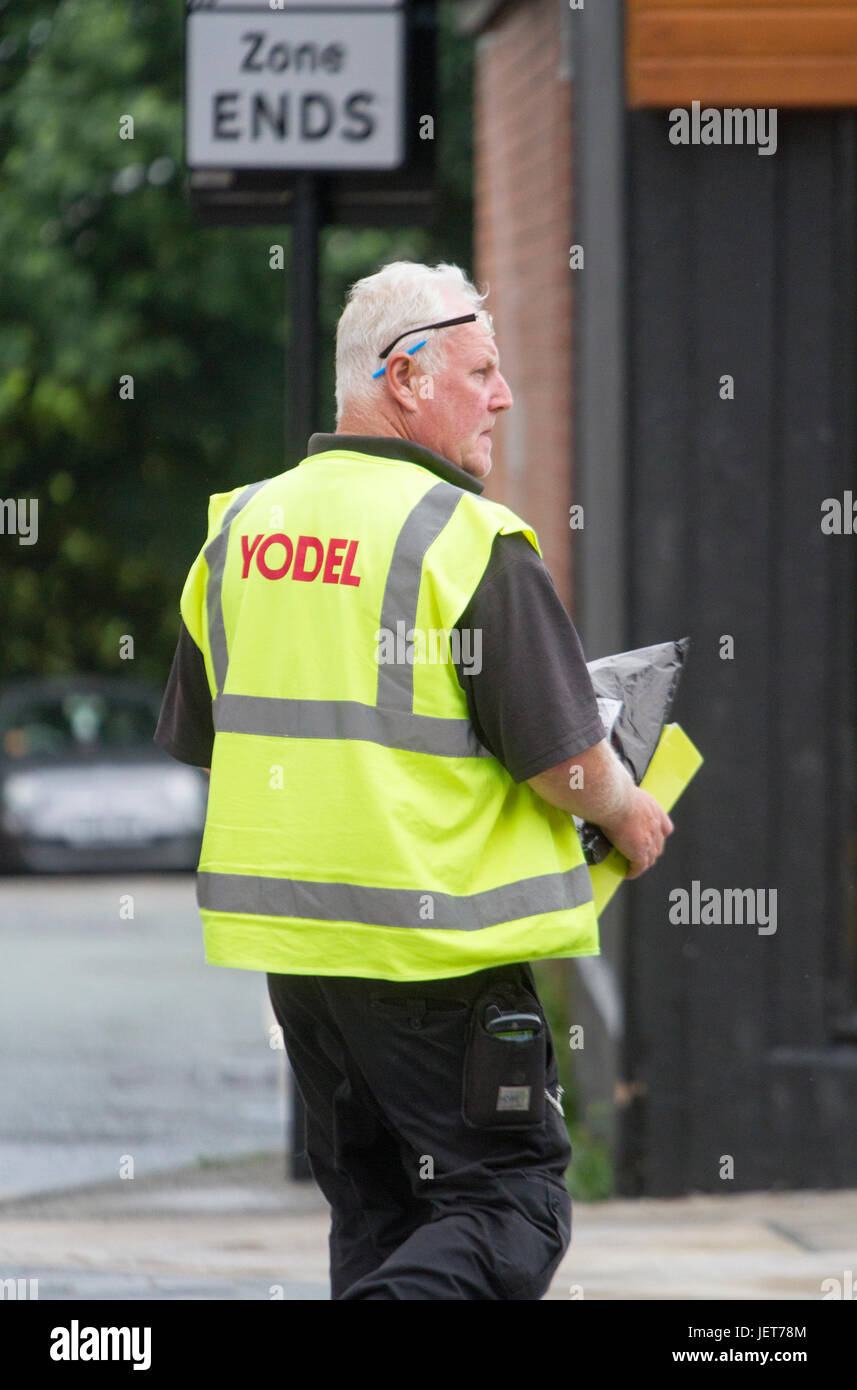Parcel delivery drivers carrying their cargo Stock Photo - Alamy