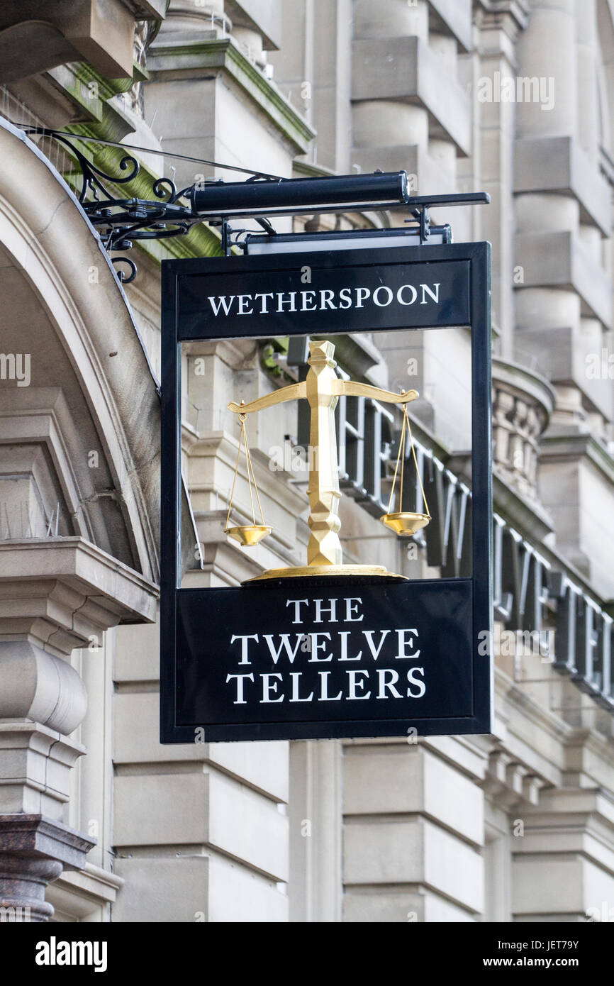 A hanging pub sign on a Wetherspoon public house in Manchester city ...