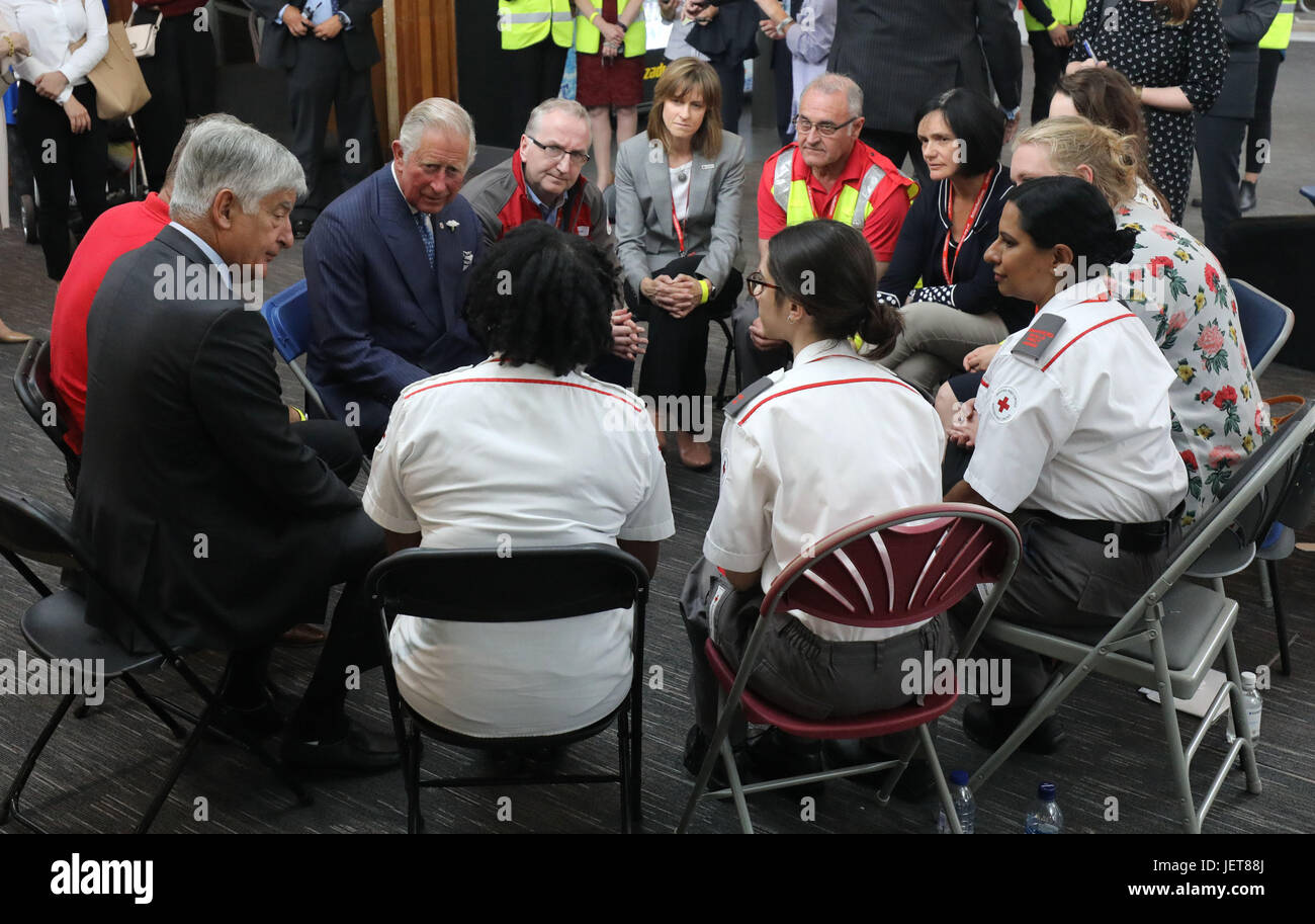 The Prince of Wales (2nd left) meets volunteers during a visit to the ...