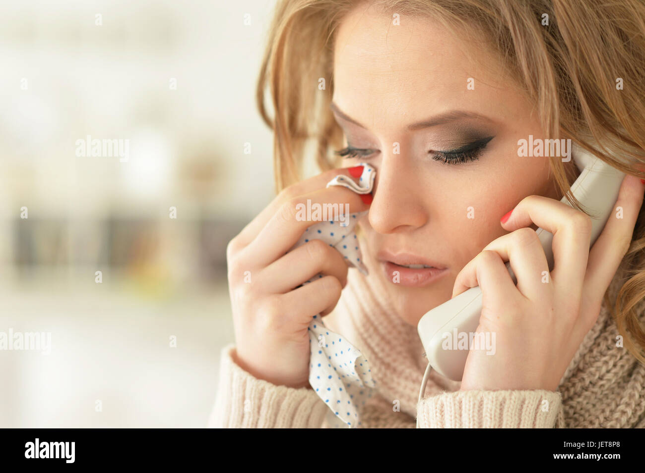Portrait of crying young woman with the phone Stock Photo - Alamy