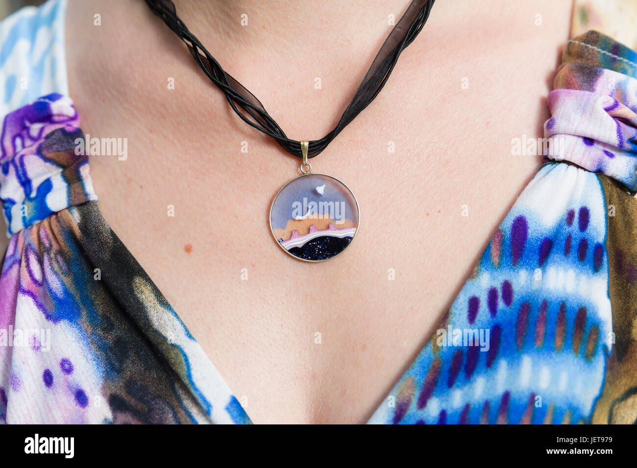 A young caucasian woman with androgynous features wears casual clothing ...