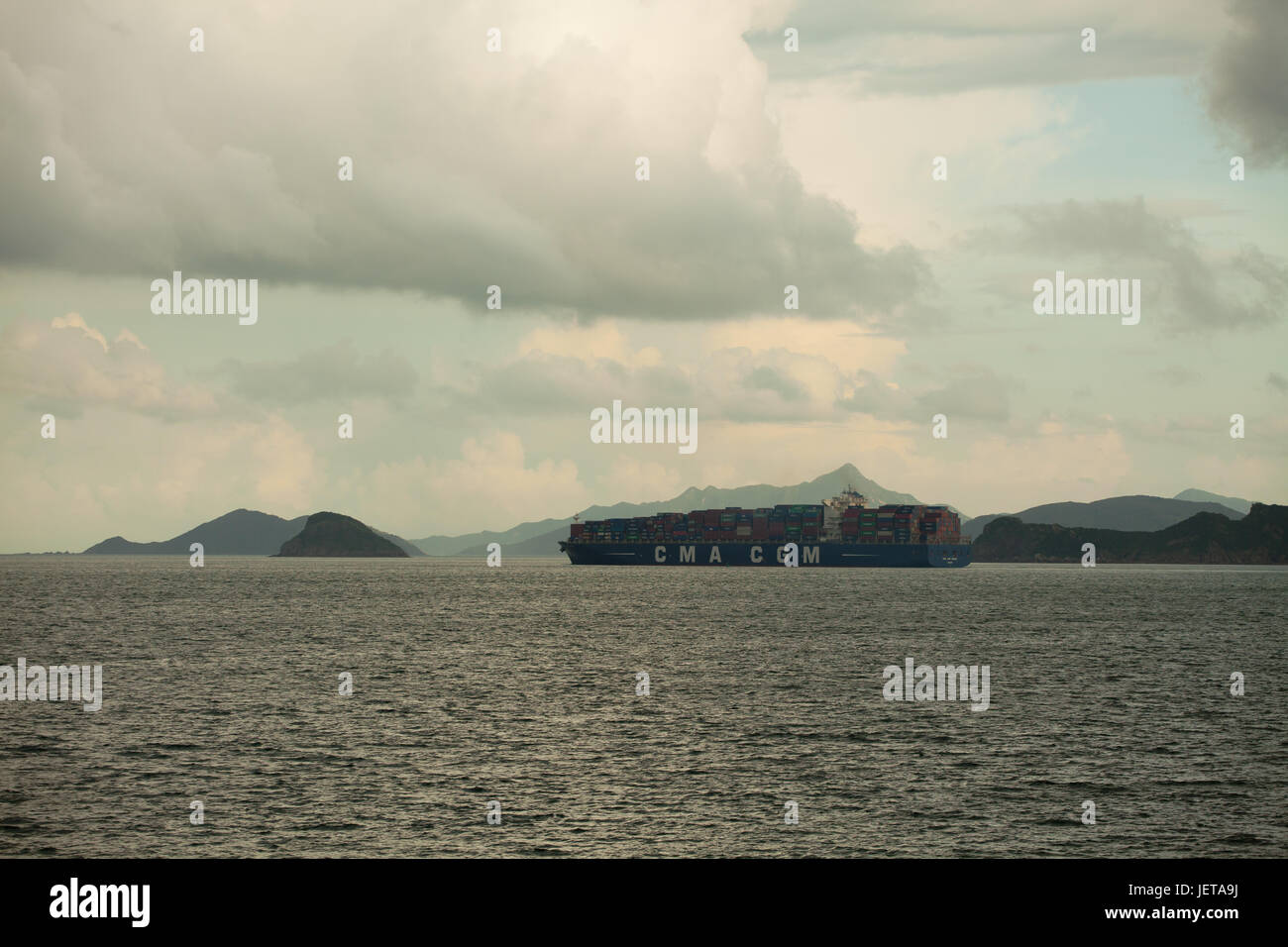 Container ship carrying thousands containers with goods, leaving ...
