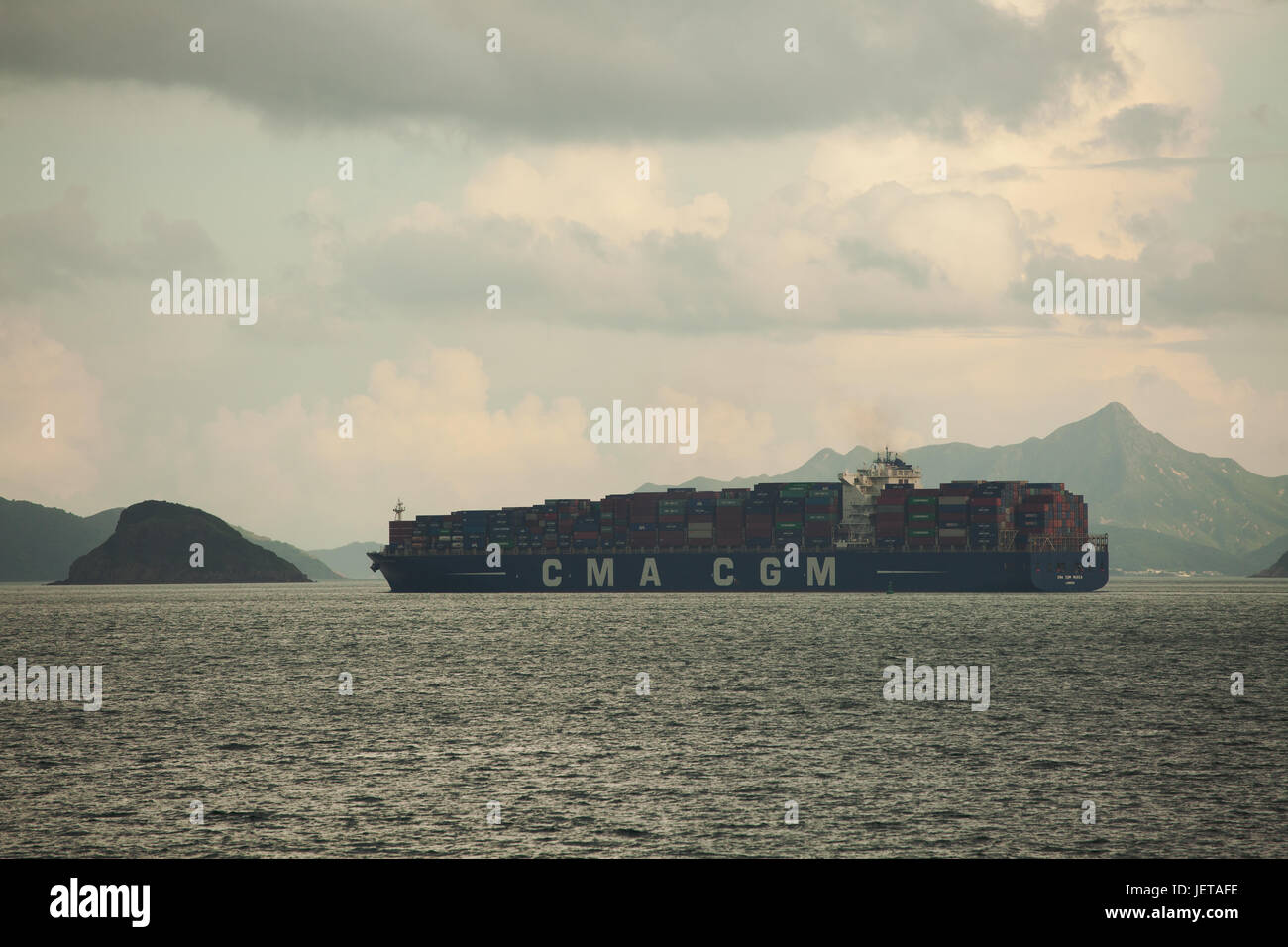 Container ship carrying thousands containers with goods, leaving ...