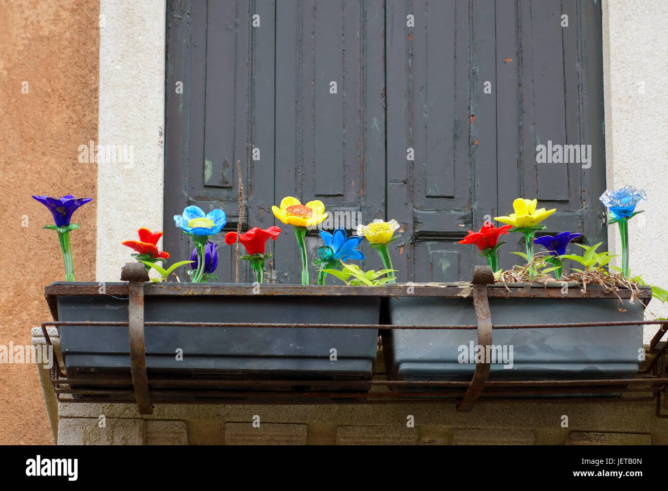 Glass flowers outside of windows Stock Photo - Alamy