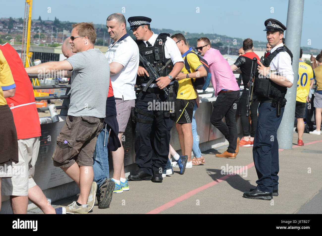 Armed police patrol crowds at the FA cup final between Arsenal and ...
