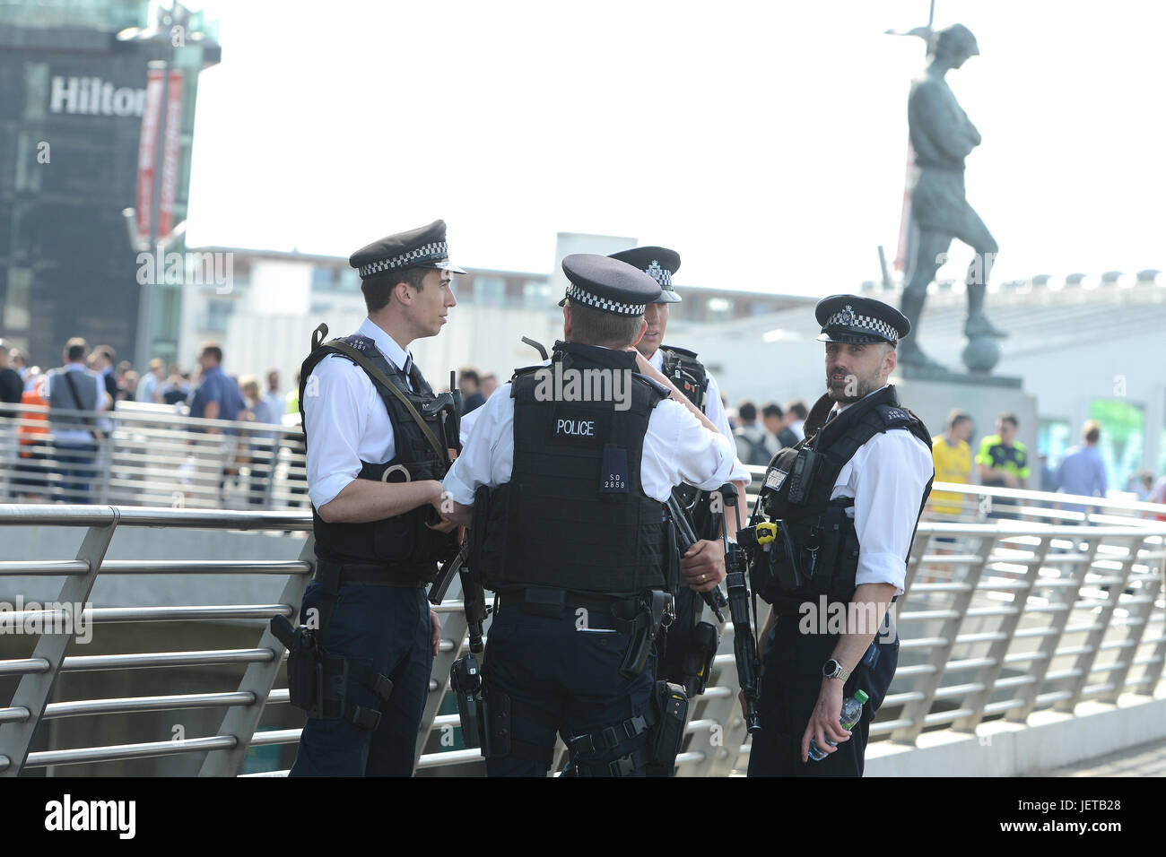 Armed police patrol crowds at the FA cup final between Arsenal and ...