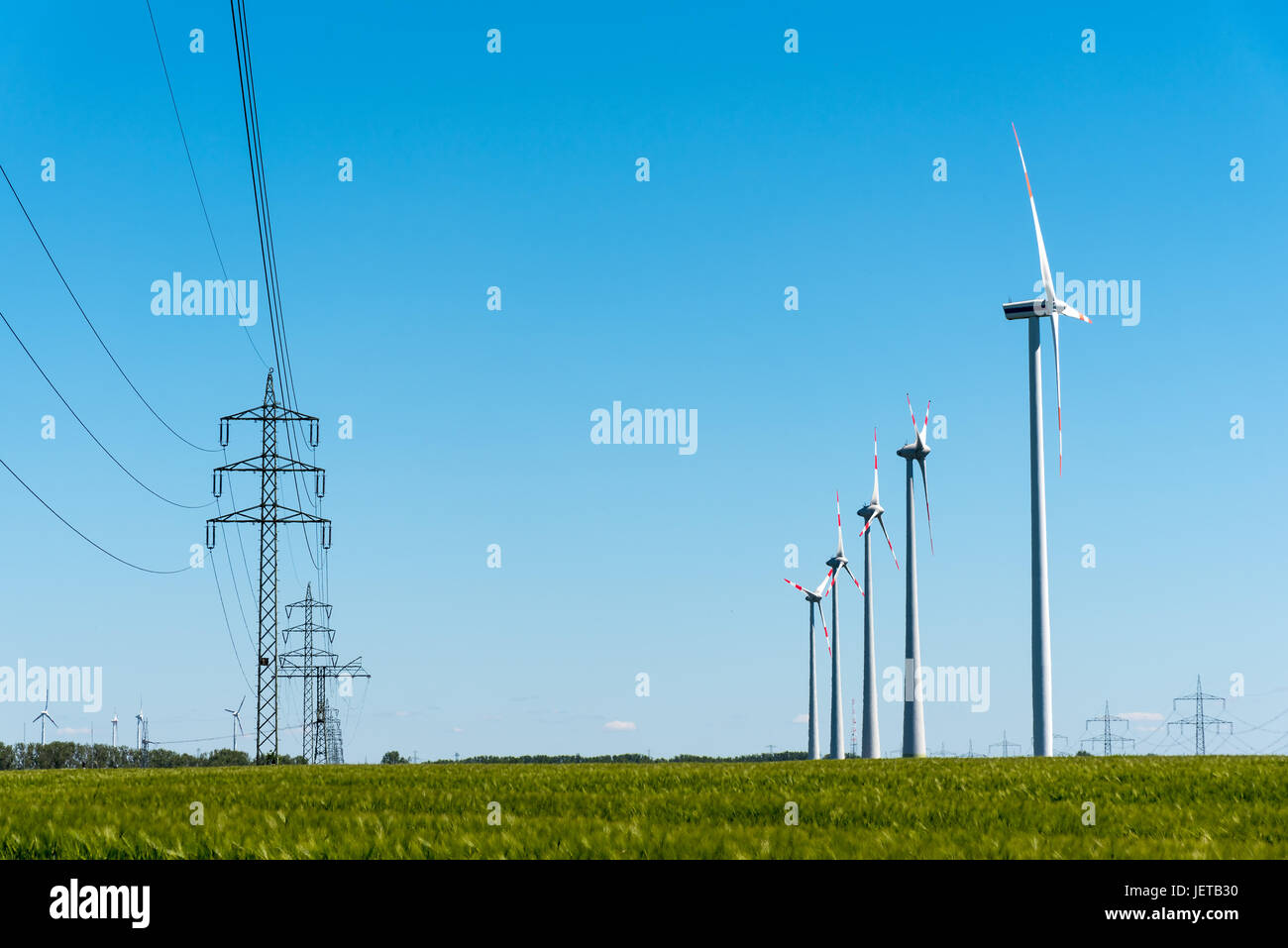 Wind turbines and power transmission lines seen in rural Germany Stock ...