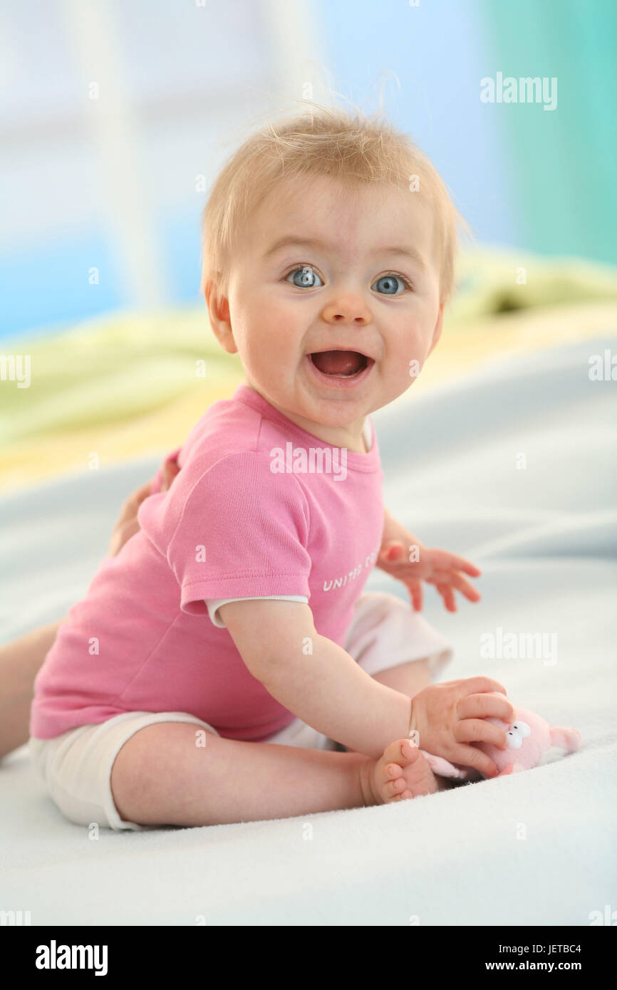 Baby, 5 months, portrait, seated Stock Photo - Alamy