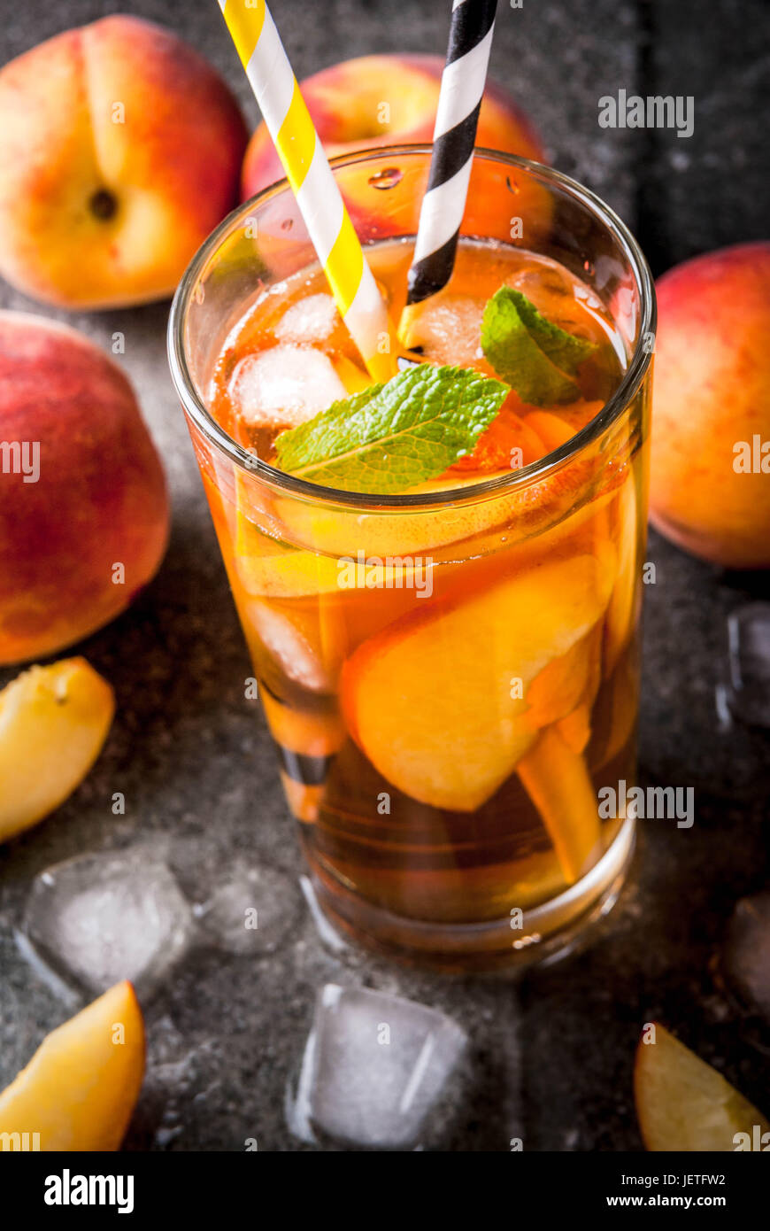 Summer refreshment drinks. Iced tea with pieces of organic home-made ...