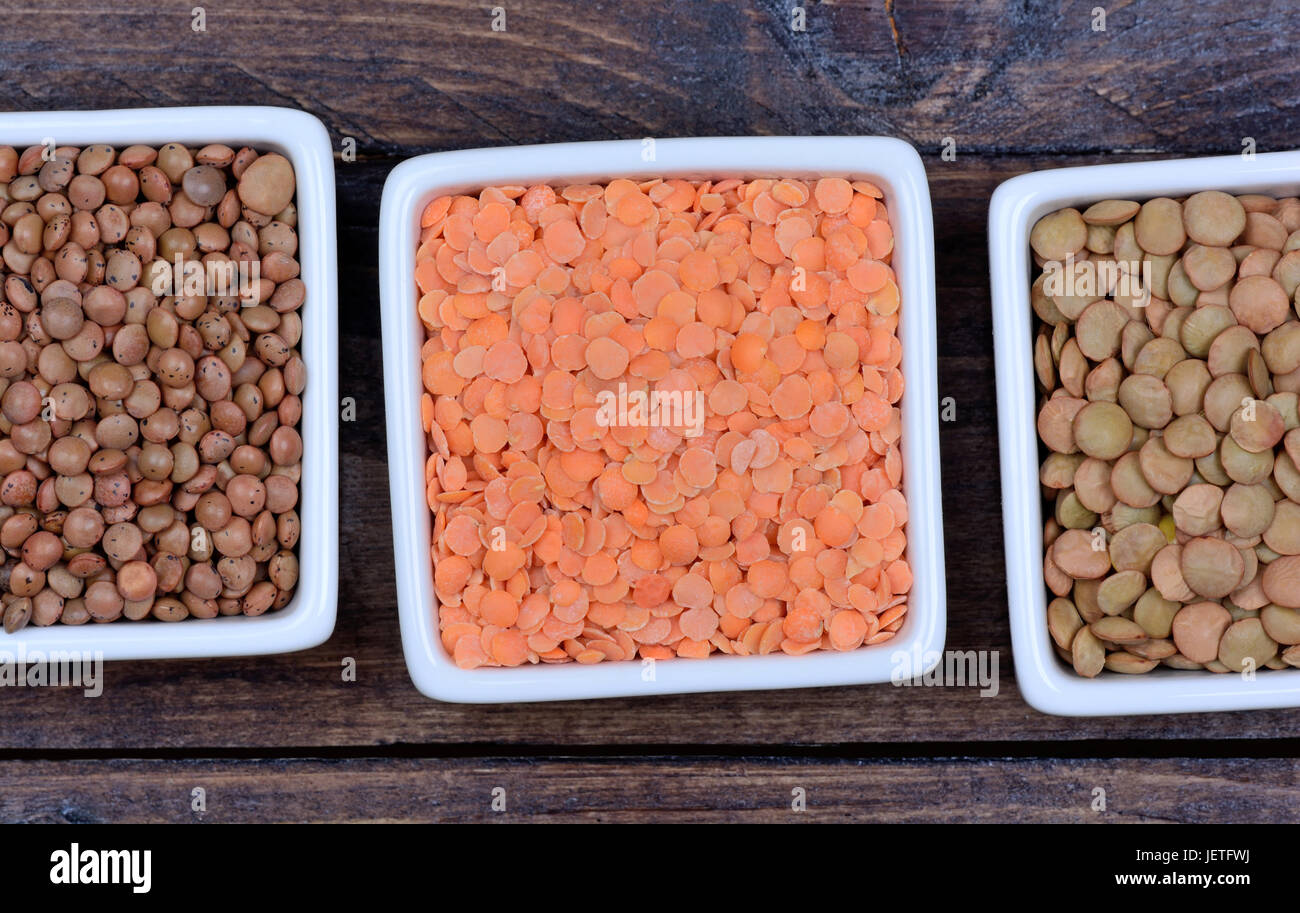 Different types of lentils in a bowls on table Stock Photo - Alamy