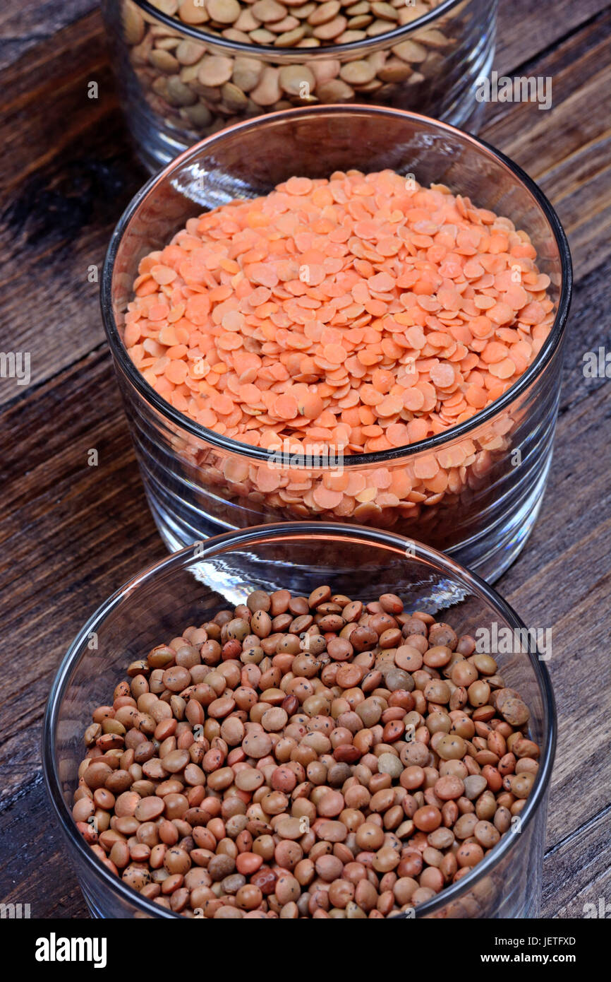 Different types of lentils in a transparent bowls on table Stock Photo ...