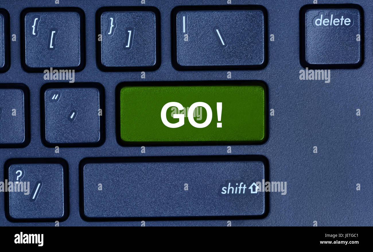 Go word on computer keyboard button Stock Photo - Alamy