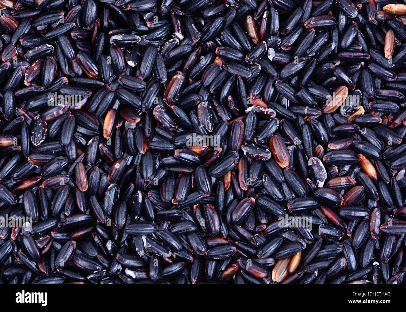 Background of black rice closeup Stock Photo - Alamy