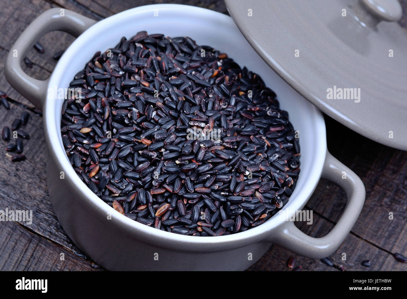 Black rice in a pot on table closeup Stock Photo - Alamy