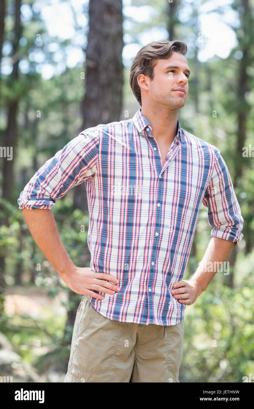 Young man with hands on hip Stock Photo - Alamy