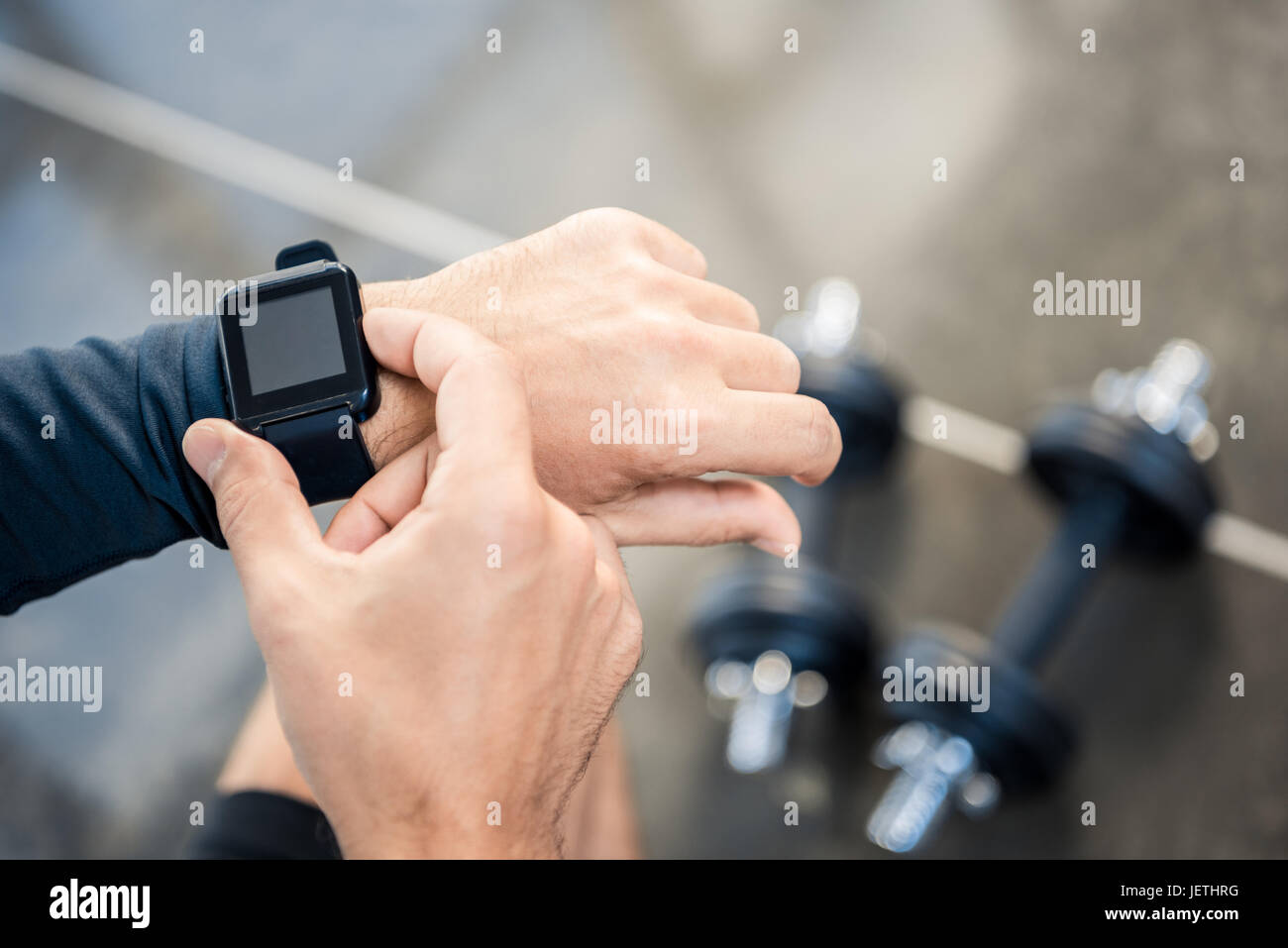 Young man using smartwatch hi-res stock photography and images - Alamy