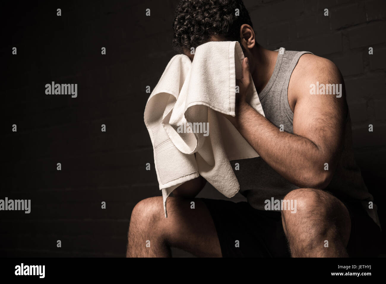 Male athlete wiping face towel hi-res stock photography and images - Alamy