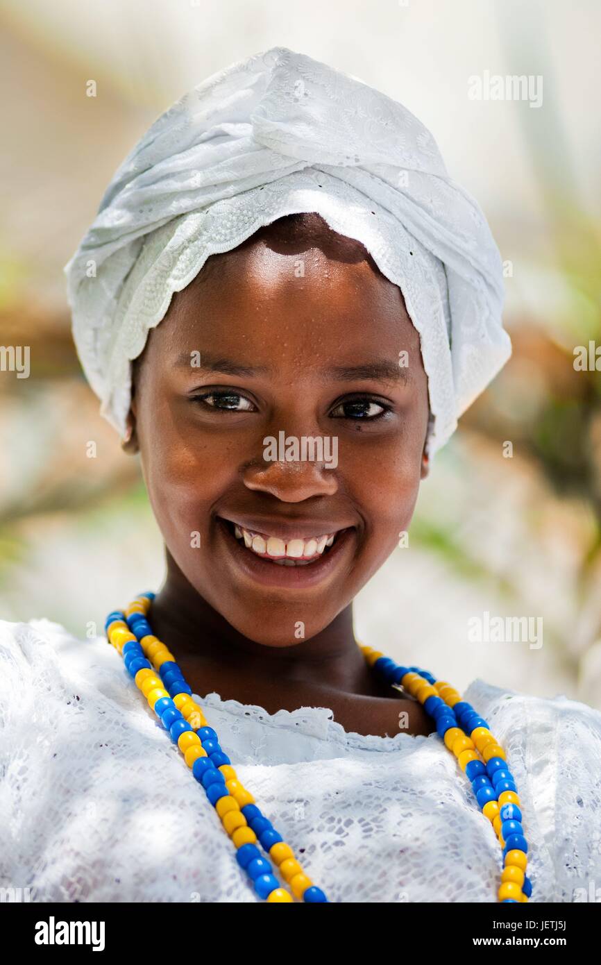 A young Baiana girl smiles during the ritual ceremony in honor to ...