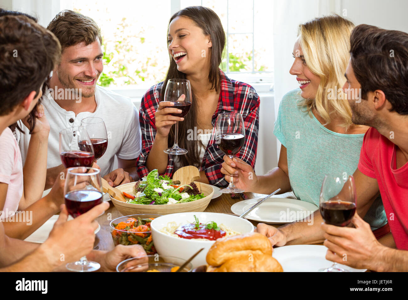 Friends having meal together Stock Photo - Alamy