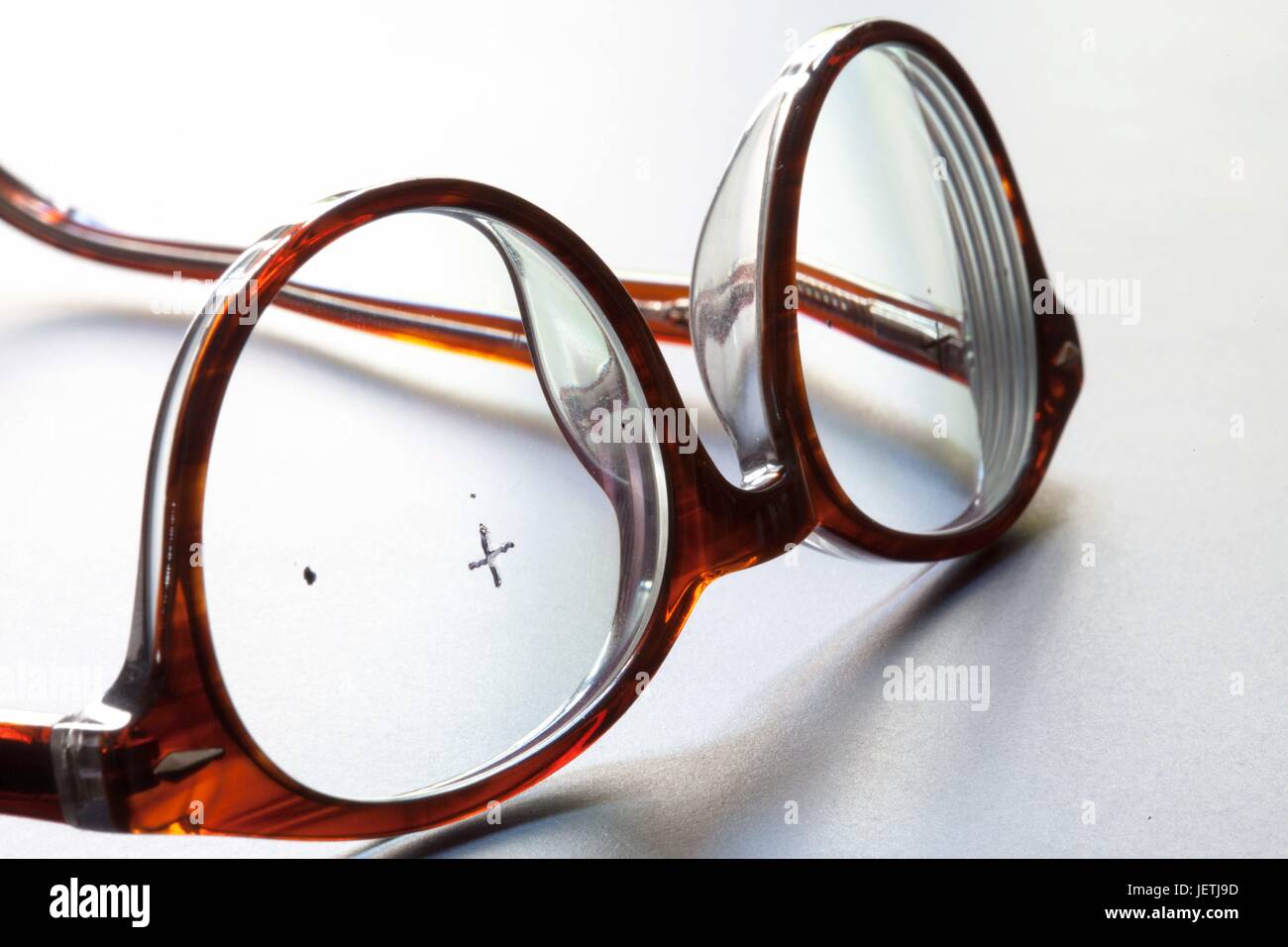 An ophtalmic optician left marks on a pair of varifocals which were ...