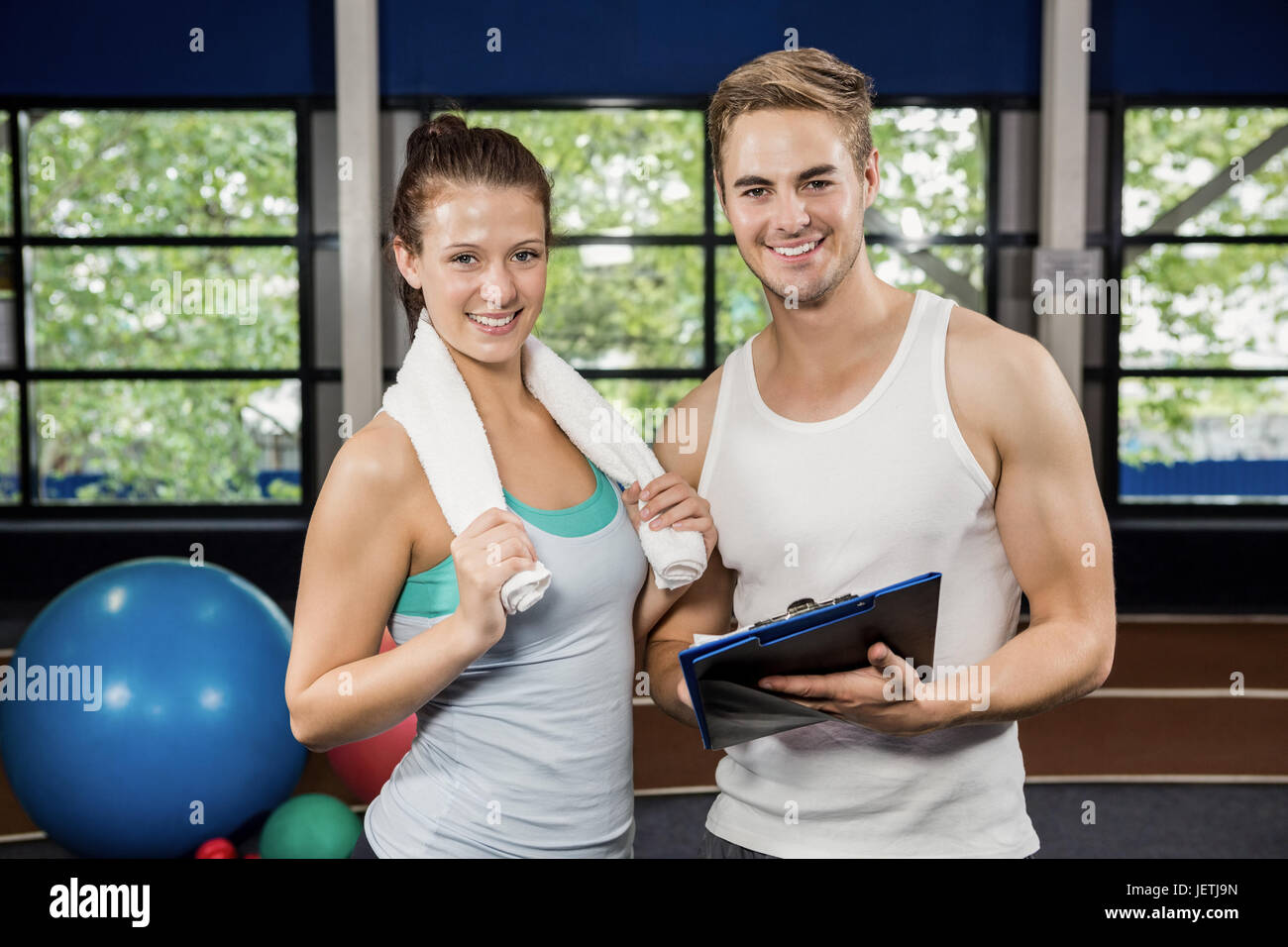 Portrait happy trainer standing hi-res stock photography and images - Alamy