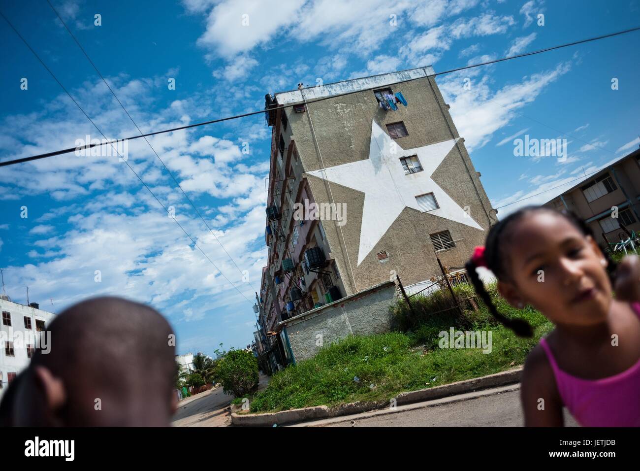 Cuban kids play in front of the large apartment blocks in Alamar, a ...