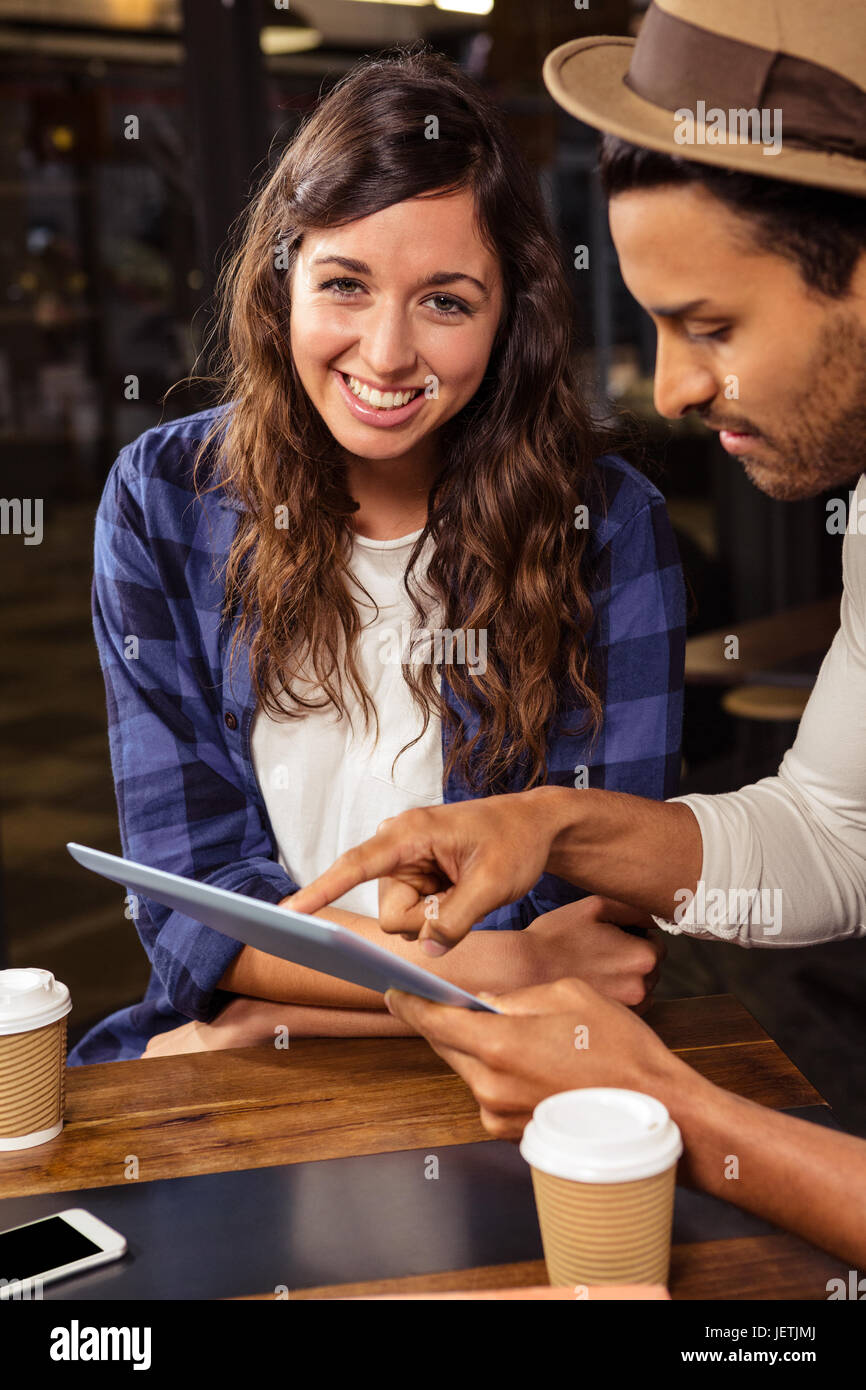 Couple using a tablet Stock Photo - Alamy
