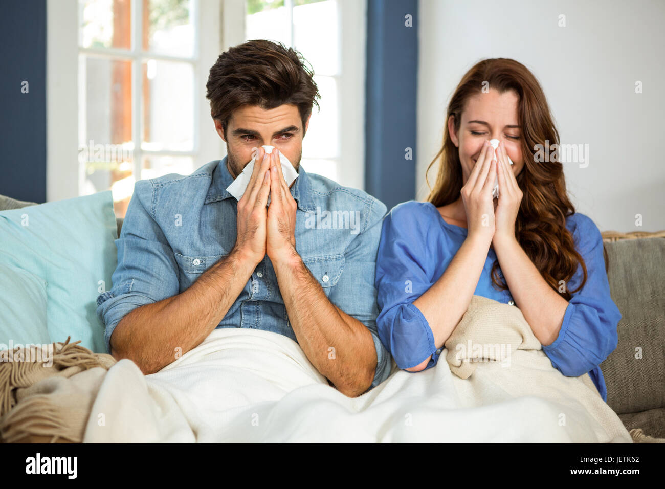 Woman blowing nose in room hi-res stock photography and images - Alamy