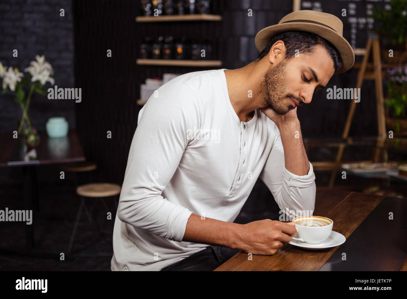 Sad man holding his coffee Stock Photo - Alamy