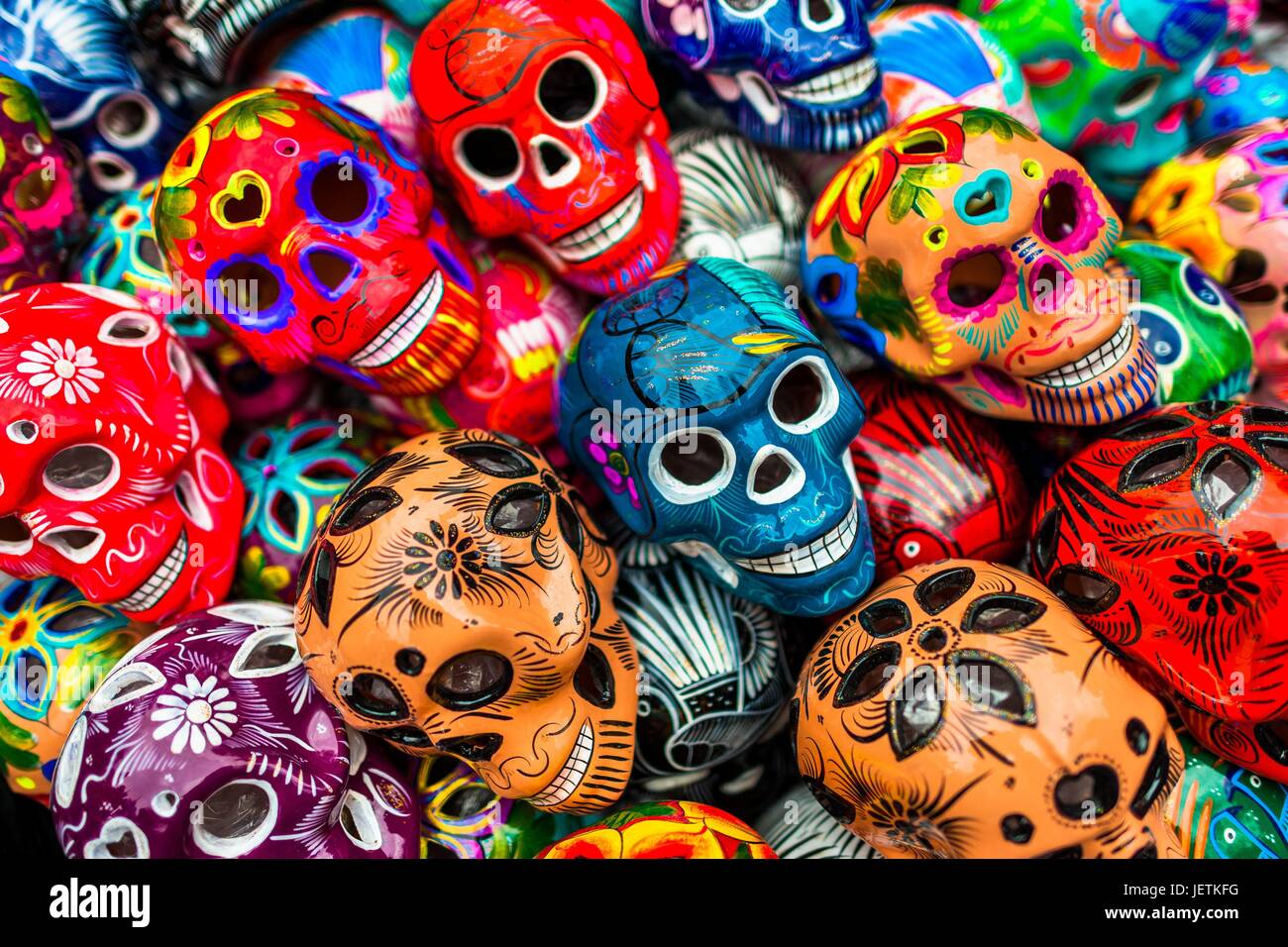 Colorful hand painted skulls (Calaveras) are sold on the market during ...