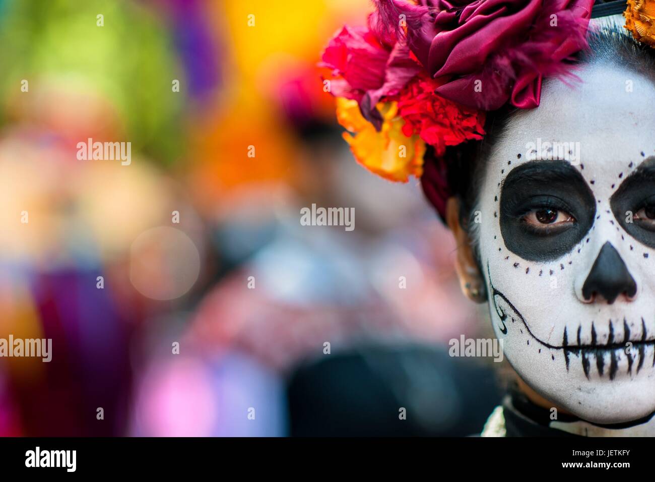 A young woman, dressed as La Catrina, a Mexican pop culture icon ...