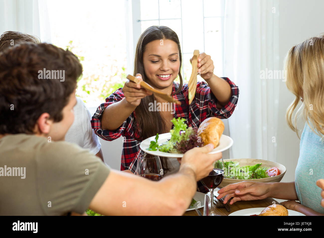 Happy friends having lunch Stock Photo - Alamy