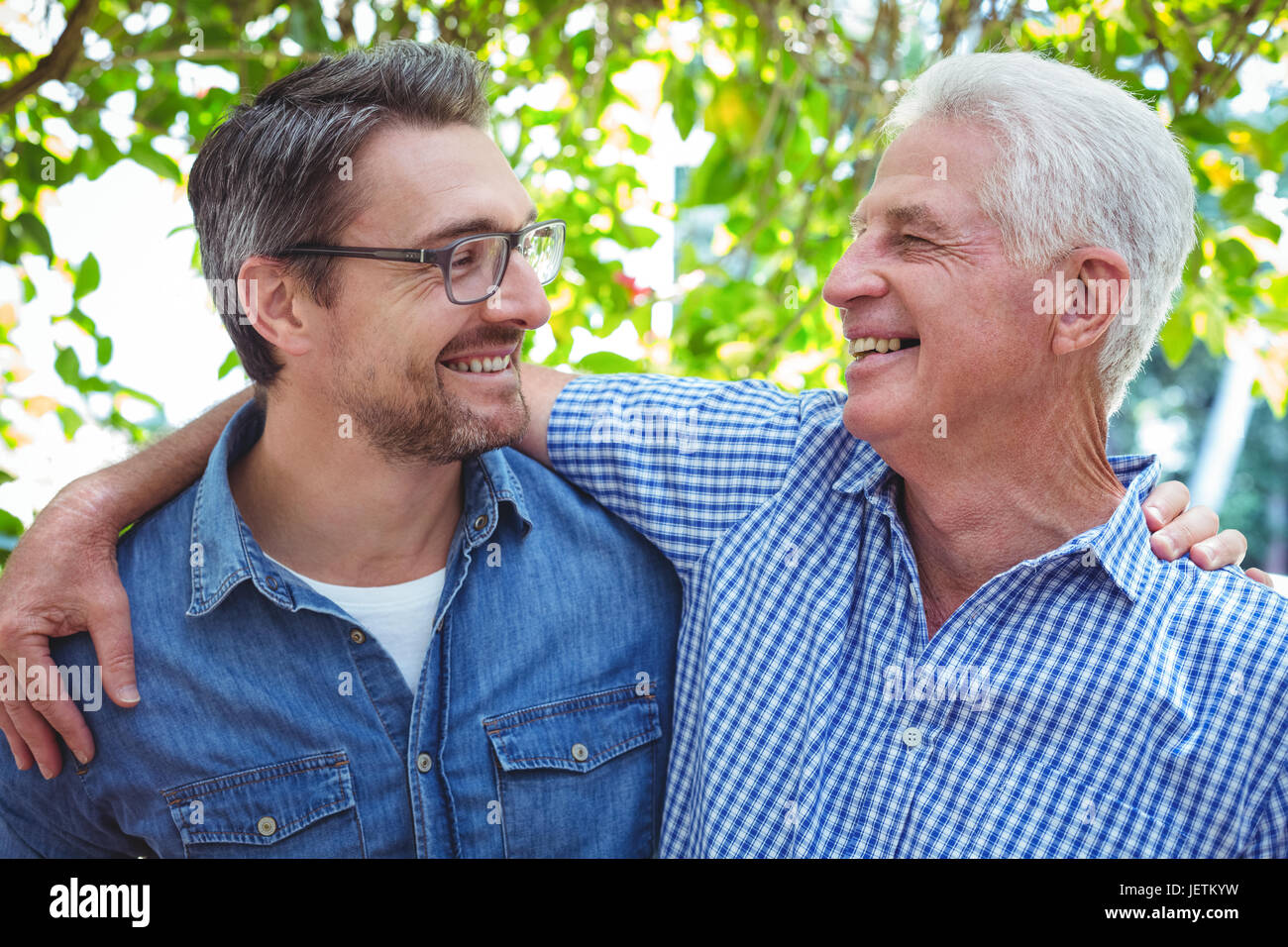 Son arm around father hi-res stock photography and images - Alamy