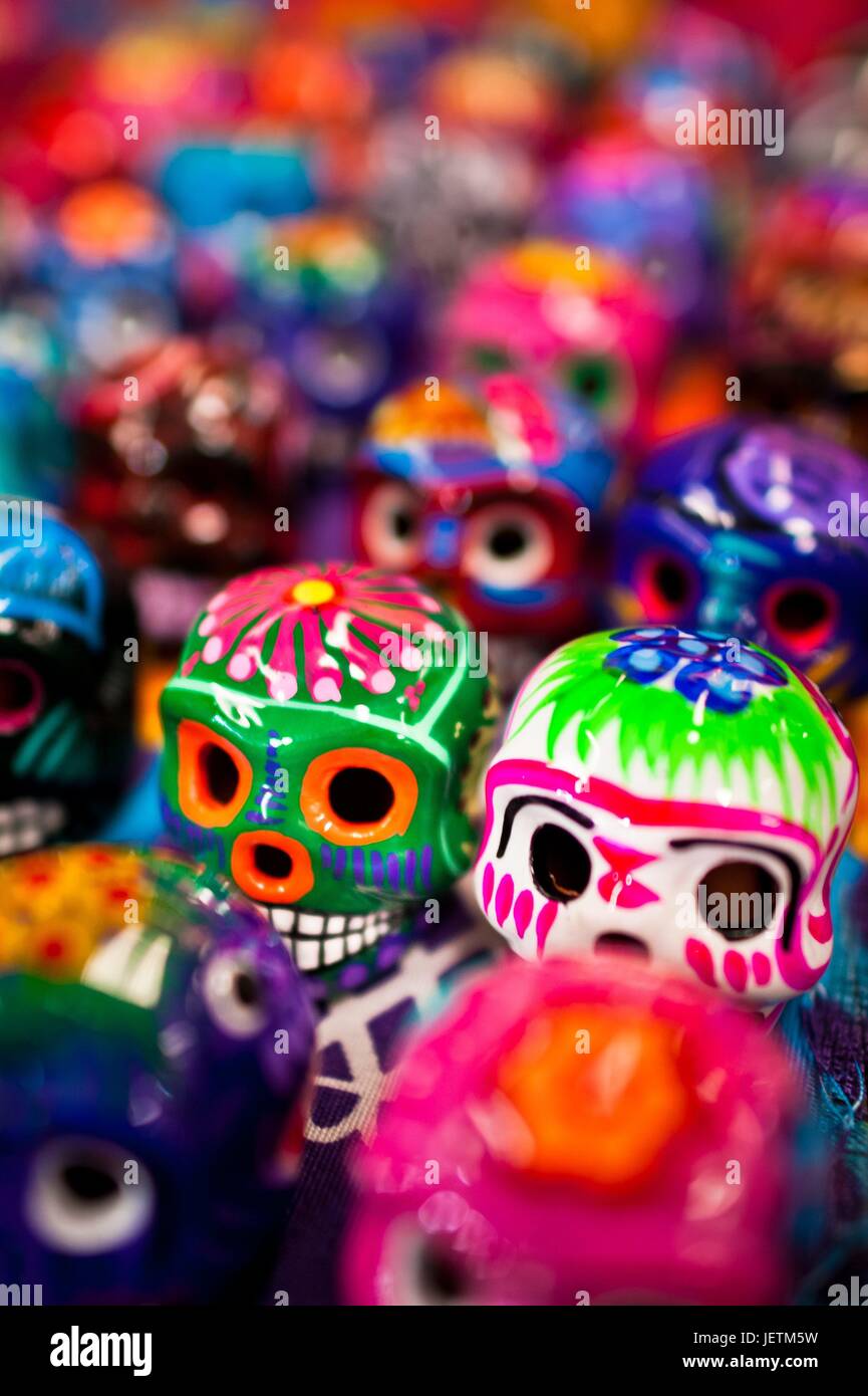 Colorful painted skulls (Calaveras) are sold on the market during the ...
