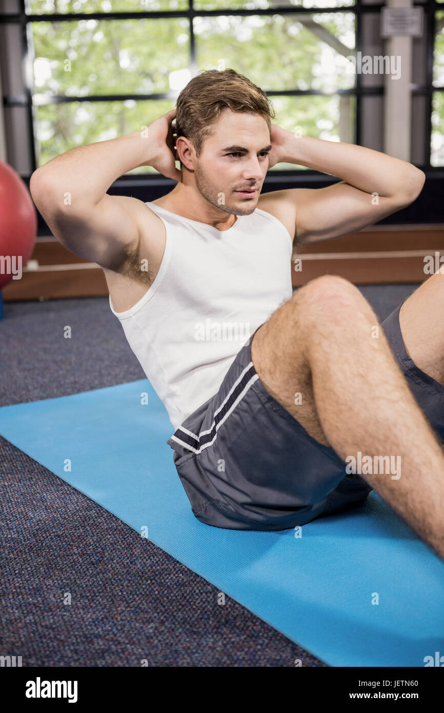 Man doing abdominal crunches Stock Photo - Alamy