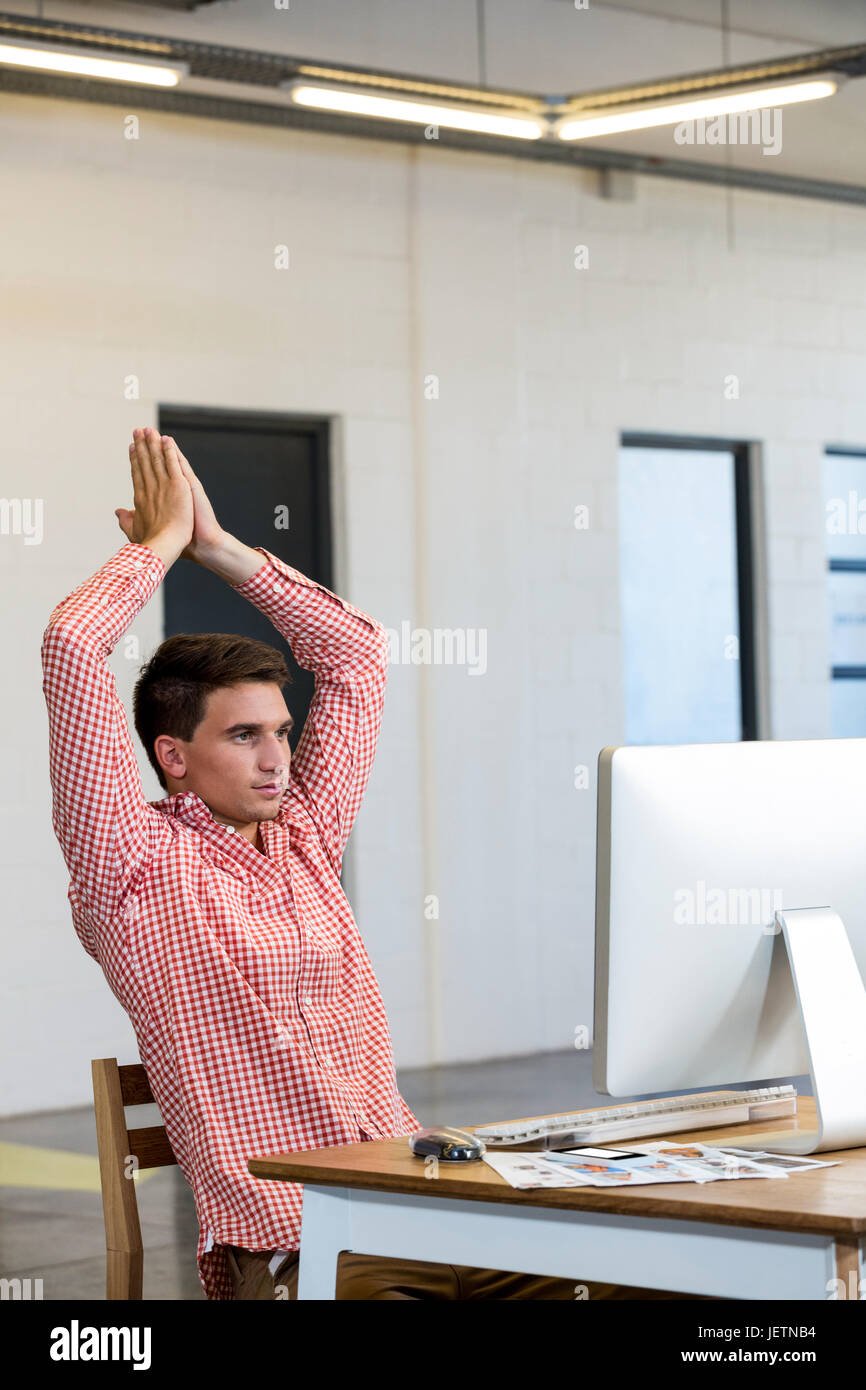 Man looking at computer in office Stock Photo - Alamy