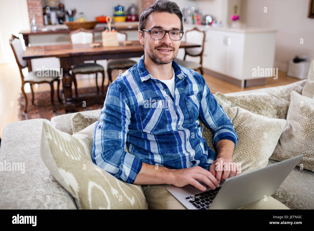 Portrait of man using a laptop Stock Photo - Alamy