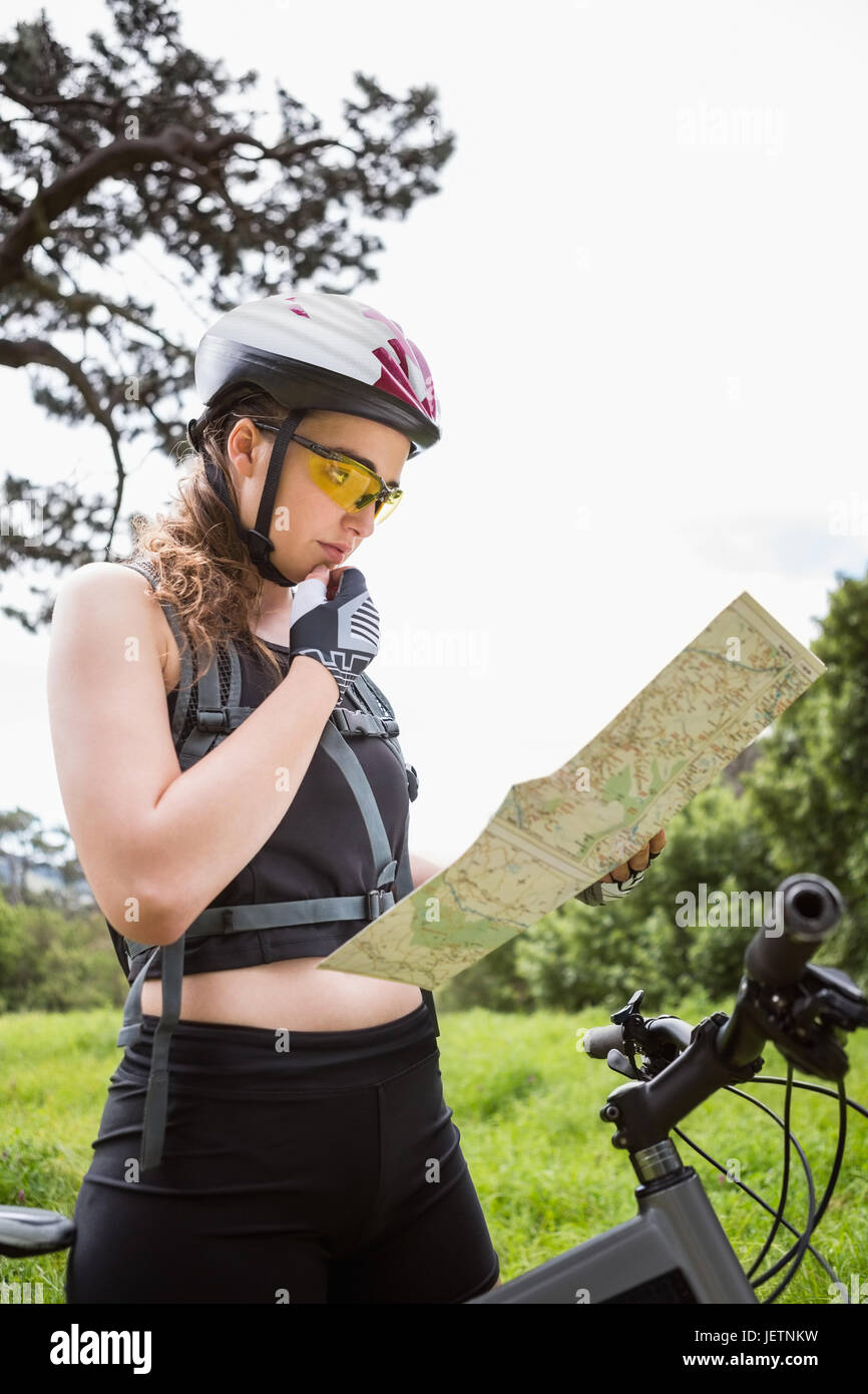 Woman checking the map Stock Photo - Alamy